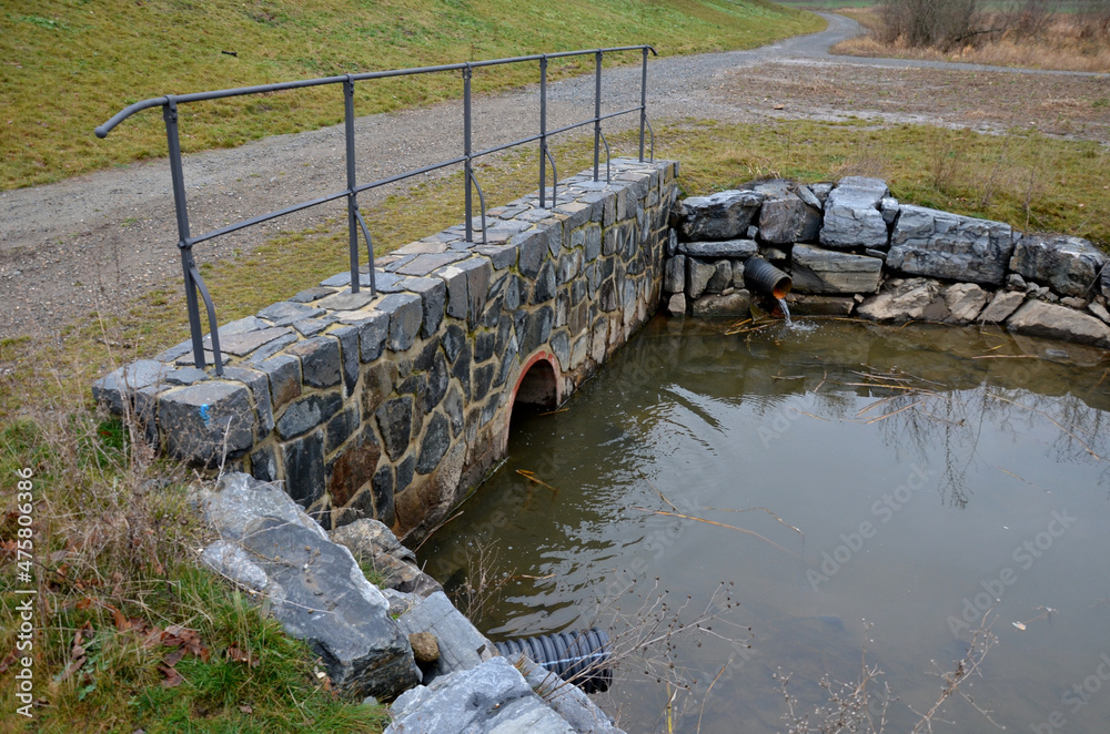 Foto de drainage of drainage water from the bottom of the dam dam or ...