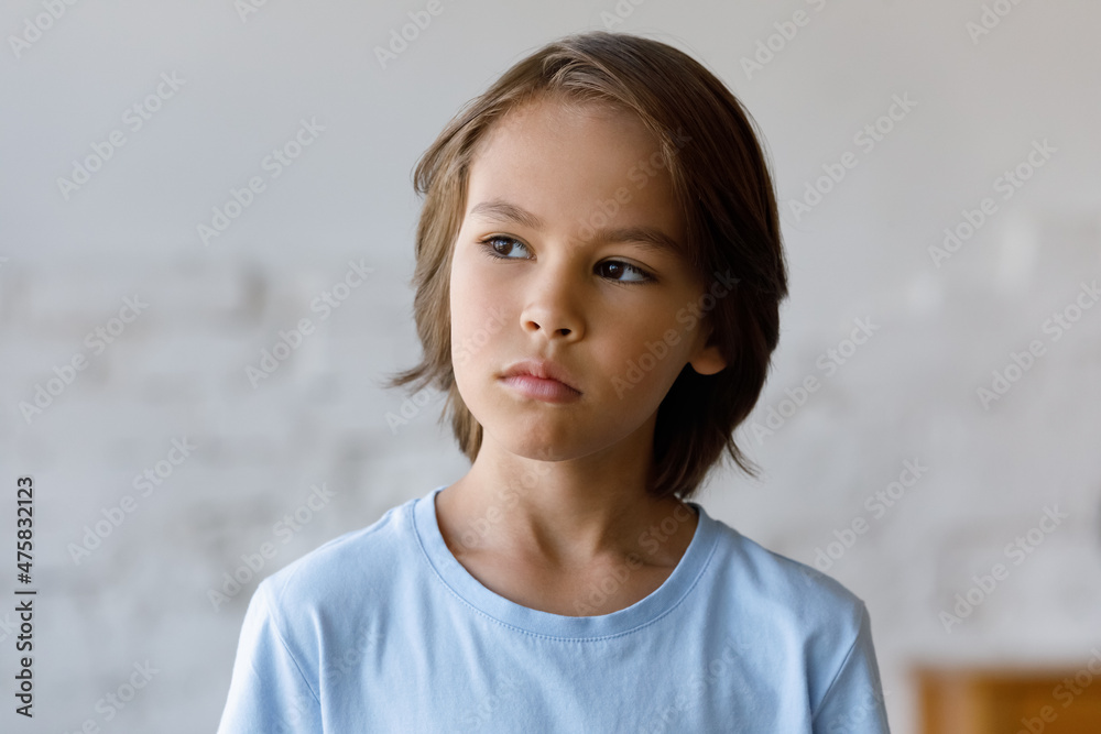 Head shot unhappy lost in thoughts 12s kid boy looking in distance ...