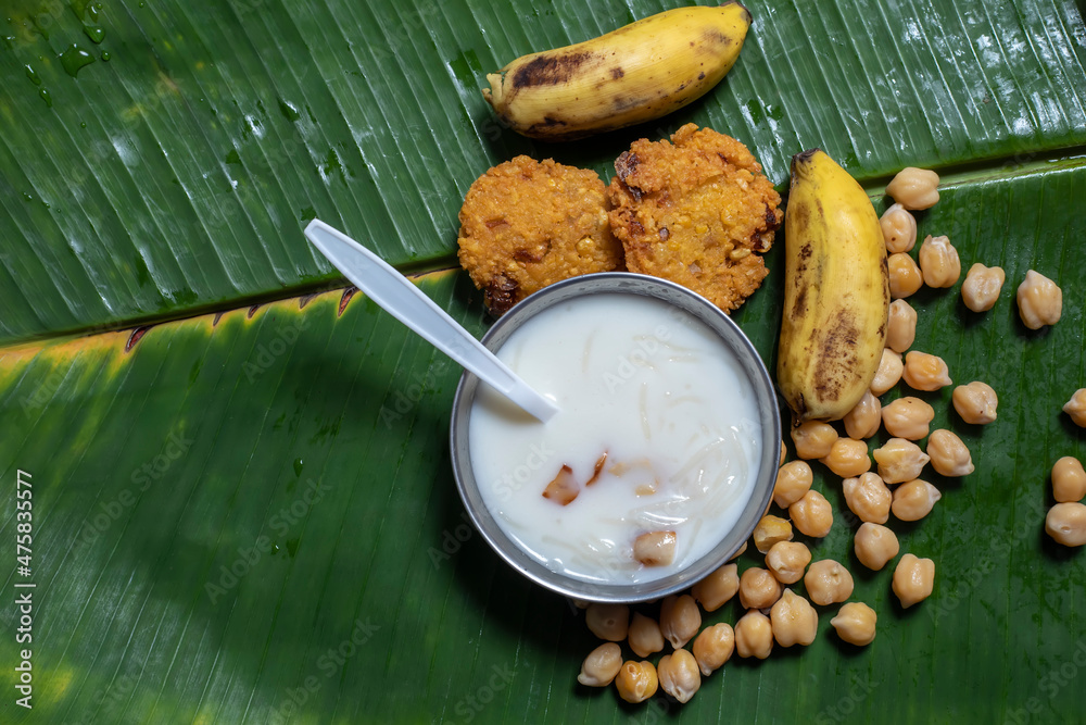 Traditional dish served on banana leaf on Indian festival day. It is ...