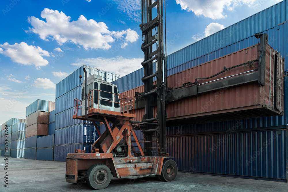 Crane lifting up container in railroad yard. Crane lifting up container ...