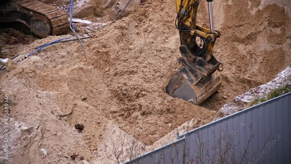 Construction Site Excavator Scooping Dirt Creating Excavation for ...