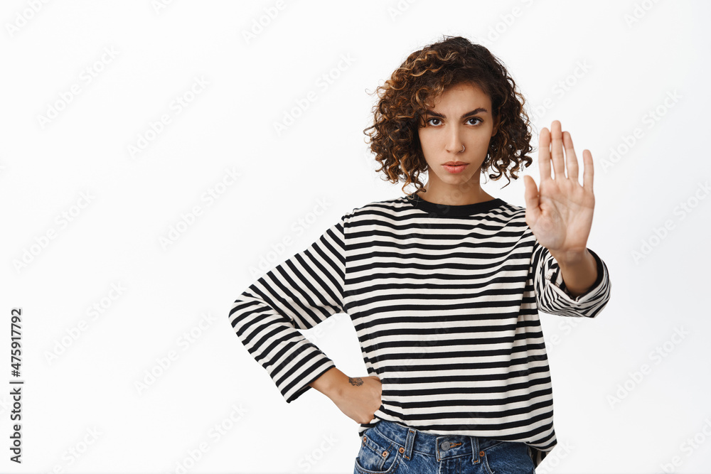 Stop. Serious and concerned young woman disapprove, prohibit action ...
