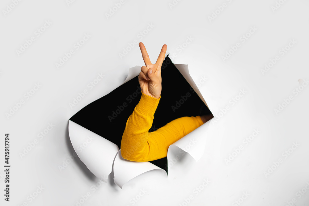 Hand of woman's hand showing fingers over isolated white background ...