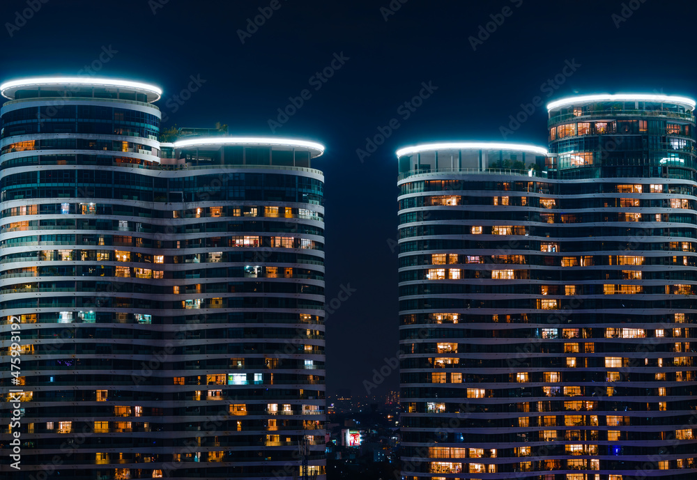 Foto de Glass facade of modern city high rise, buildings show lighting ...