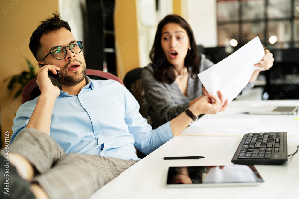 Colleagues arguing in office. Angry businesswoman yelling at her ...