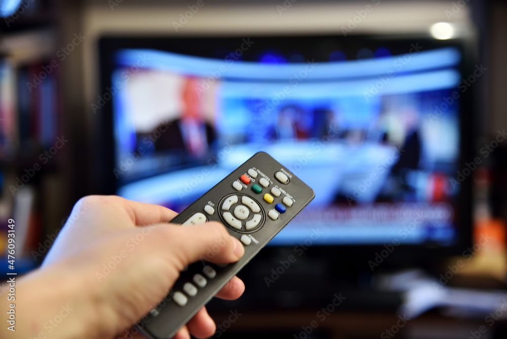Remote controller with TV screen and news chanel. Stock Photo | Adobe Stock