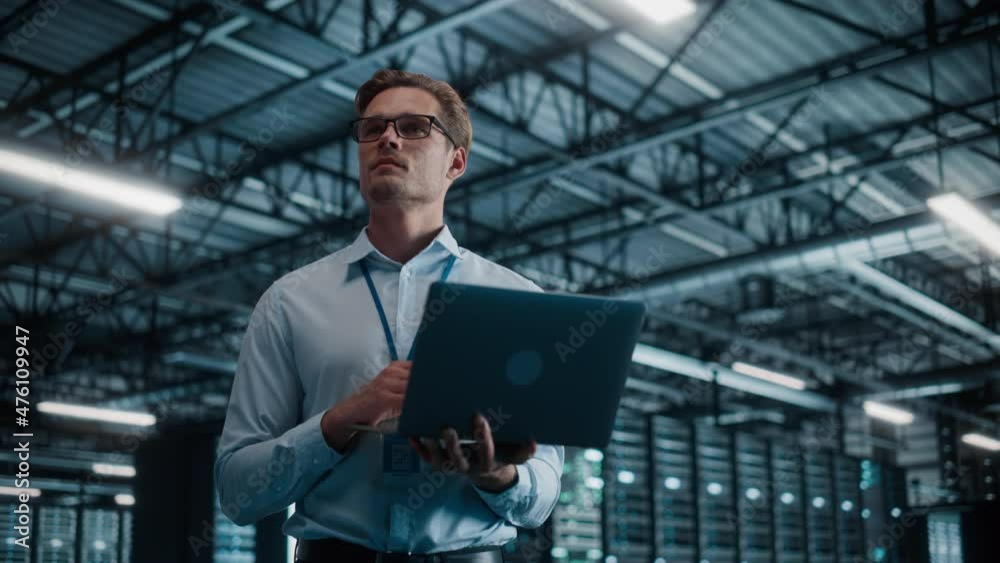 Big Data Center Chief Technology Officer Using Laptop Computer. Server ...