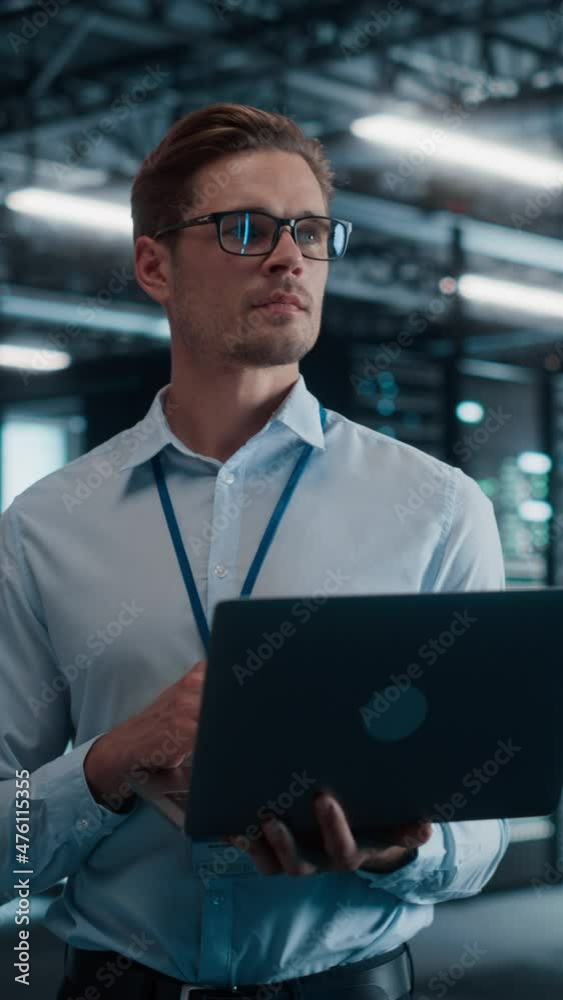 Vertical Screen Big Data Center Chief Technology Officer Using Laptop Computer Server Farm