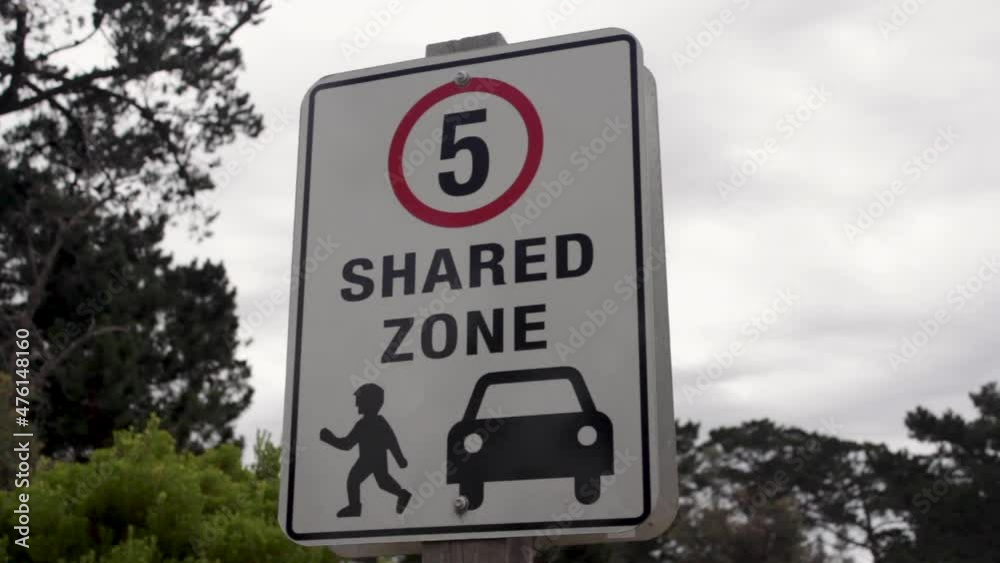 Five-kilometer miles speed limit shared zone sign with an illustration ...