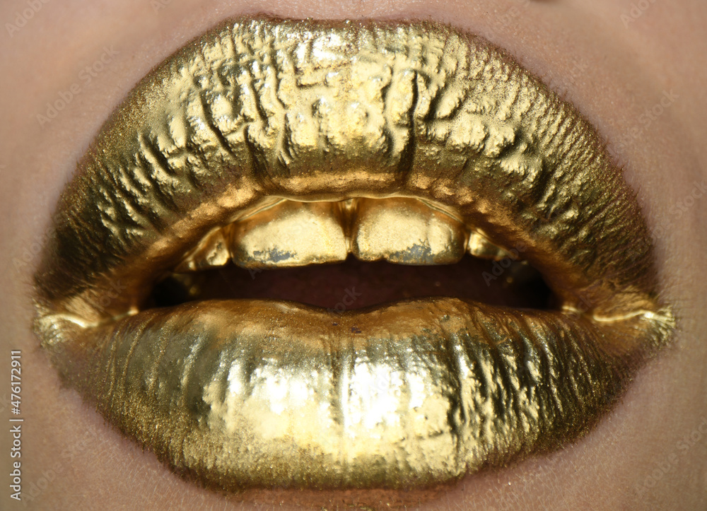 Sexy girl golden lips, gold mouth. Glowing gold skin make-up. Glitter ...