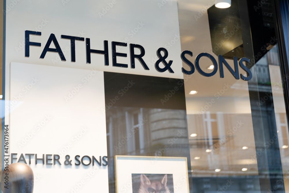 Father & Sons logo text and windows entrance brand sign front of store ...