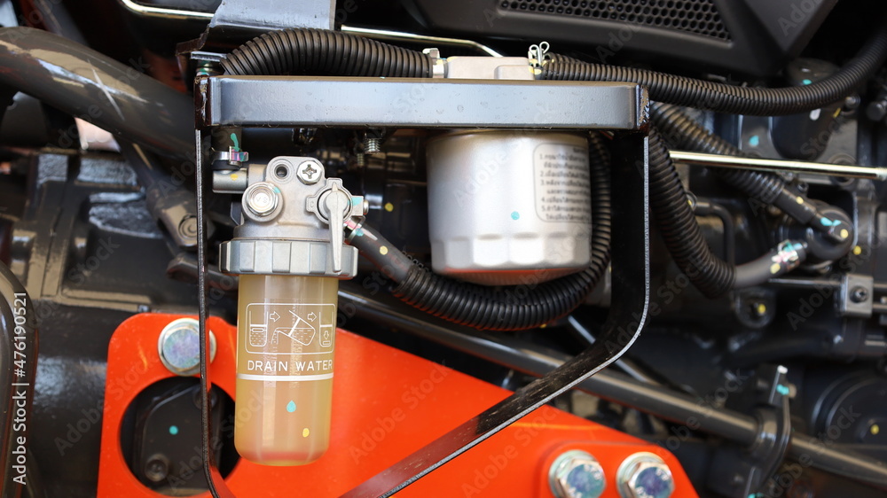 Filter water trap tractor. Fuel filter water trap and protective metal ...