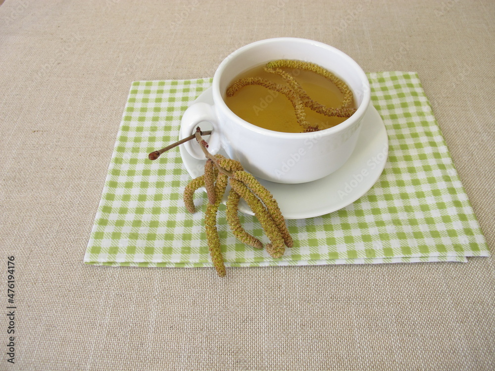 Herbal tea with hazel catkins, hazel flowers from hazel shrub Stock ...