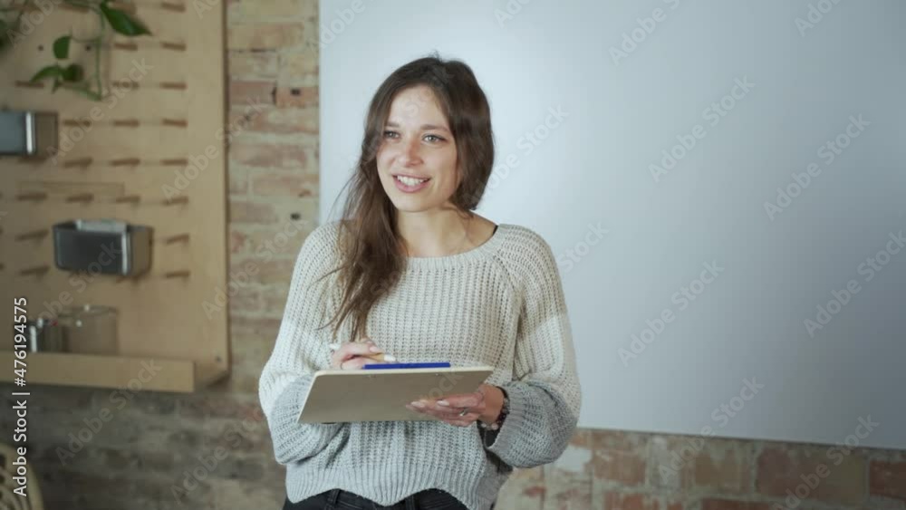 Female student presentation in classroom. Dark hair talking smiling and ...