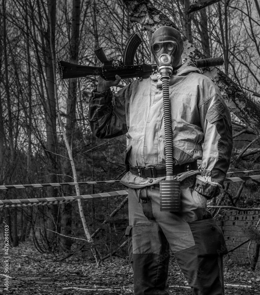 Armed stalker in a gas mask, black and white photo. Apocalypse ...
