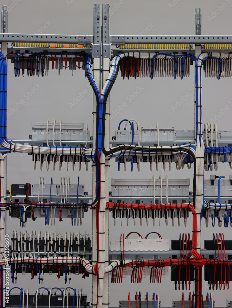 Installation of blocks and modules in an electrical panel with colored ...