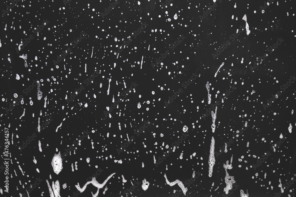 Soap texture. Black background. Foam the water. Soap bubble stain ...