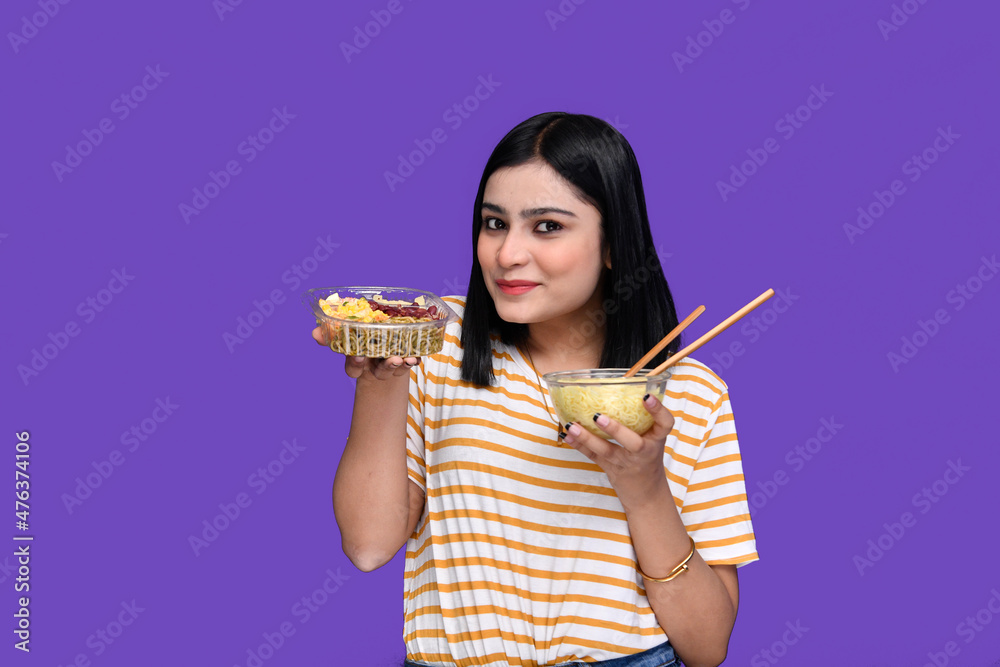 foodie girl holding spaghetti and noodles posing at camera indian ...