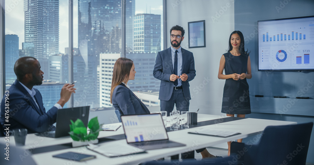 Diverse Office Conference Room Meeting: Male Executive and Asian Female ...