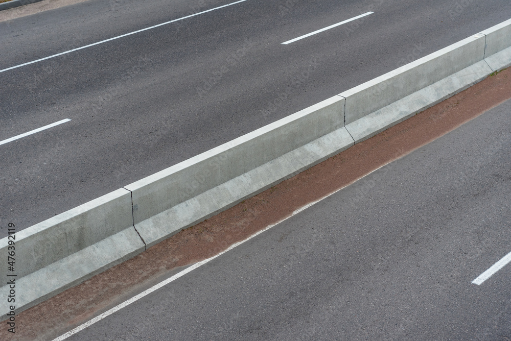 Road with markings and the separation barrier "New Jersey" Stock Photo ...