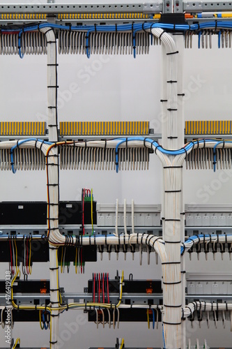 Installation of blocks and modules in an electrical panel with colored ...