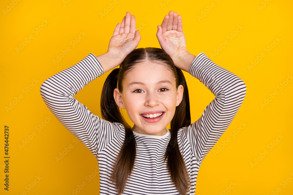 Photo of young girl happy positive smile grimace hold hands bunny ears ...