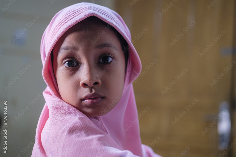 Cute Asian Muslim girl wearing a hijab or pink Islamic dress. Stock ...