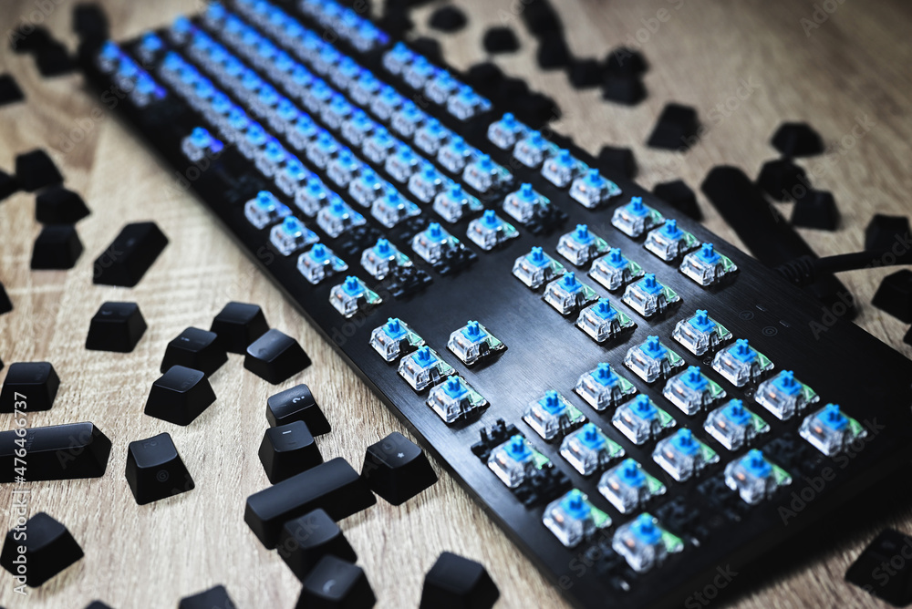 Disassembled black gaming mechanical keyboard. The keycaps are ...