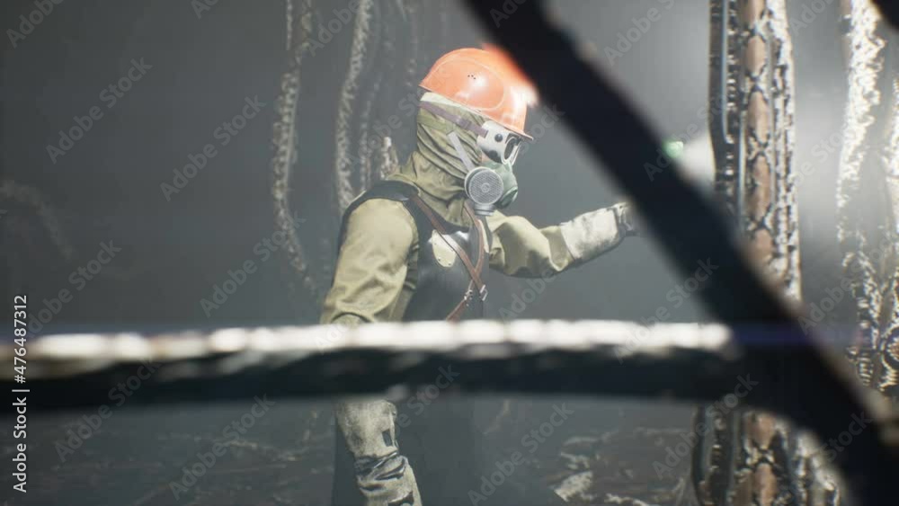 Stockvideo A biologist in a protective special suit walks through a ...