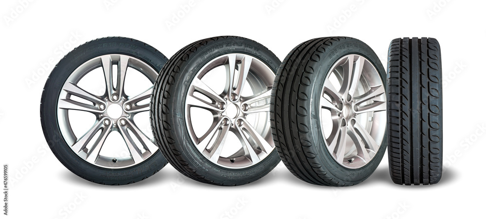 Set of four wheels on white background. New tires on aluminum wheel ...