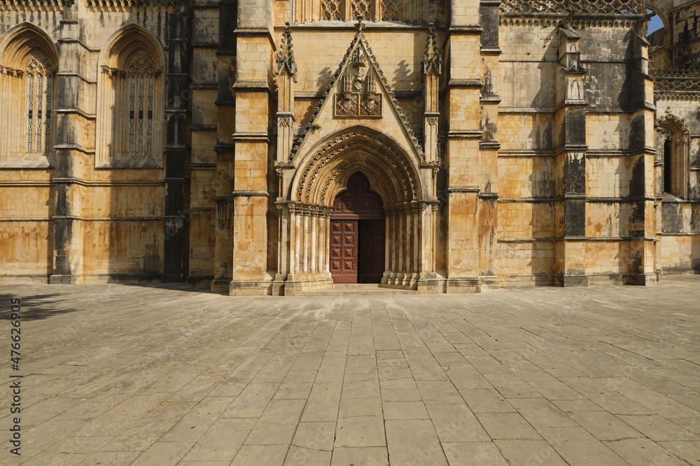 entry of the western façade of the Batalha Monastery facing the large ...