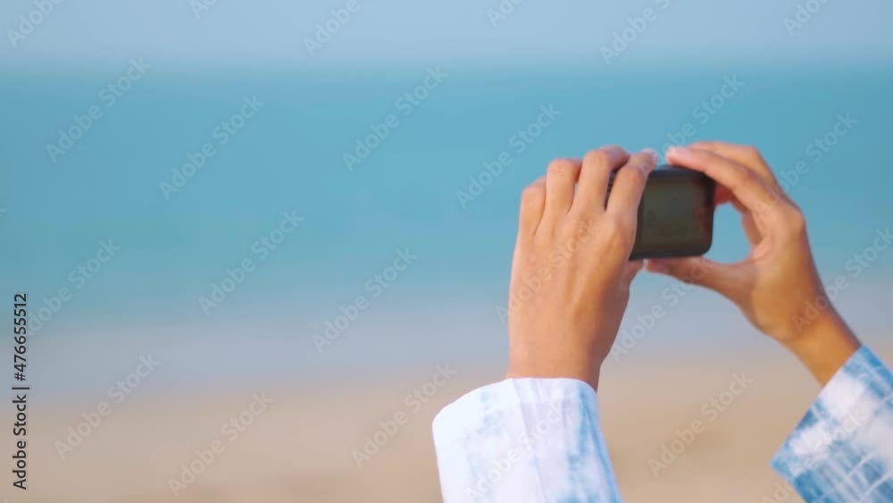 Close up shot of girl photographer shooting video with action camera at ...