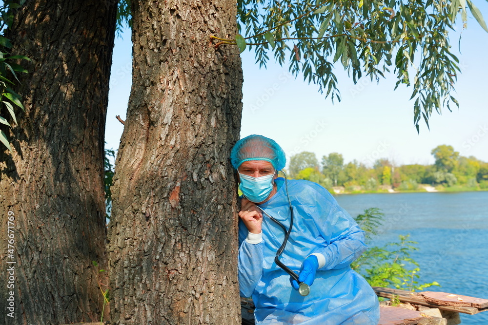 COVID-19 Pandemic Coronavirus. Caucasian male doctor pediatrician in ...