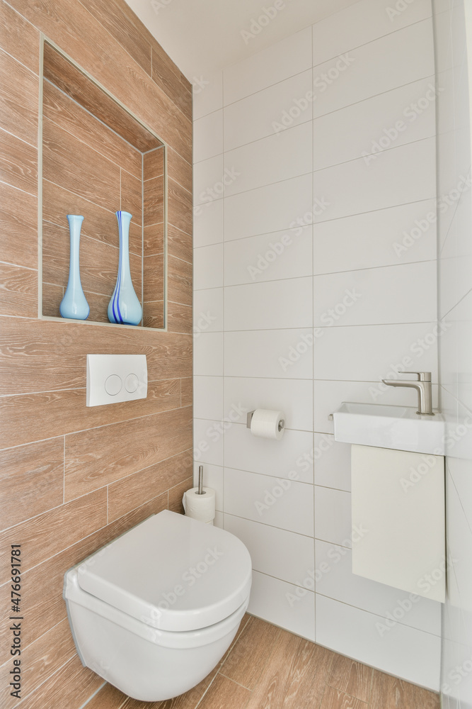 Stylish restroom design with modern wall-hung toilet Stock Photo ...