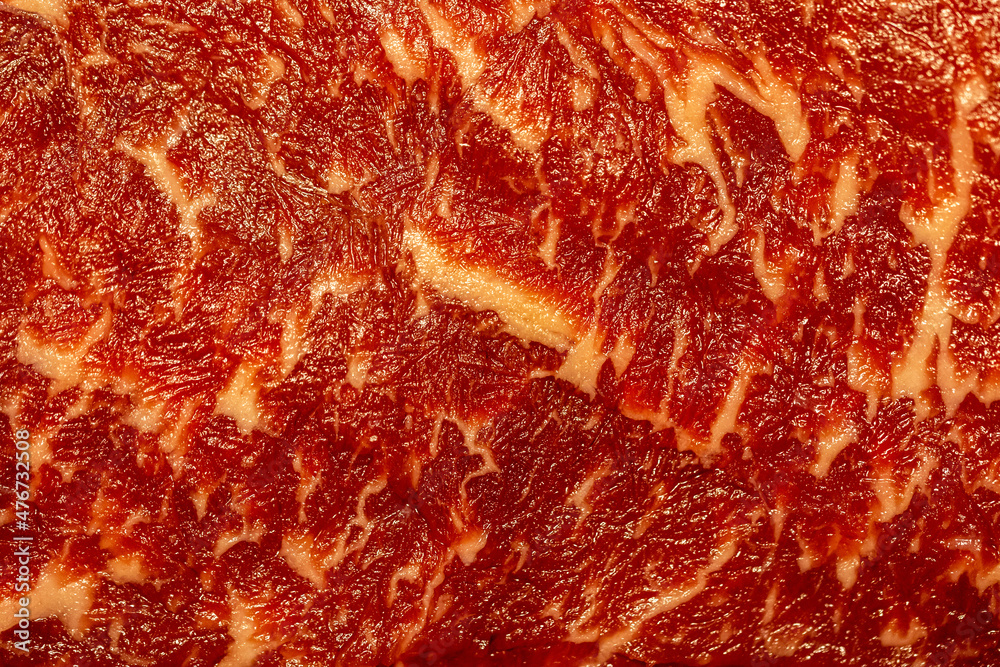 Raw wagyu hereford mixed beef with marbled fat as close up background ...
