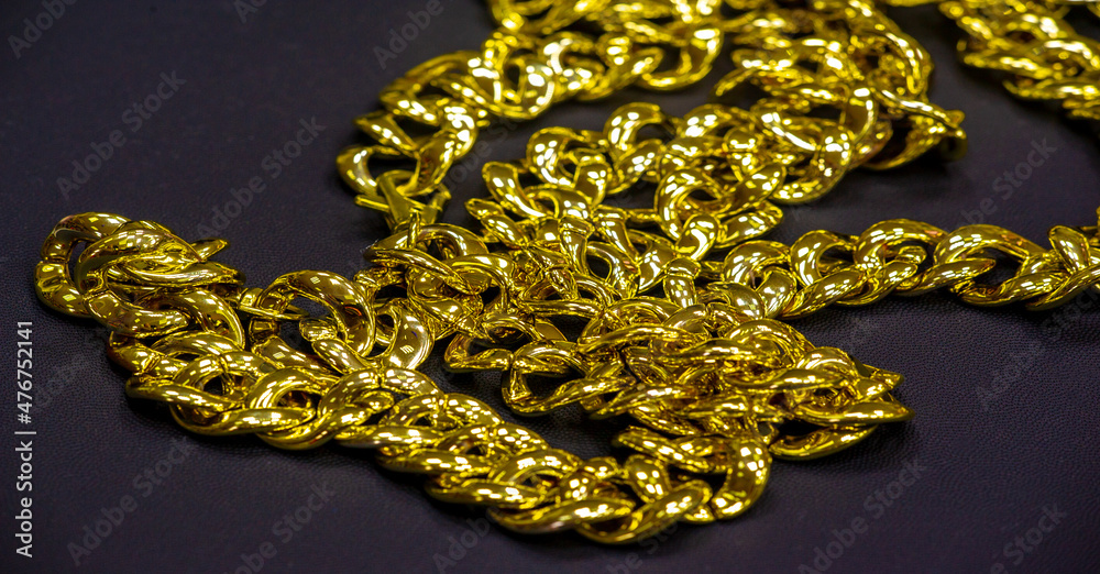 Gold chain to be worn around the neck. A chain is a sequential assembly ...