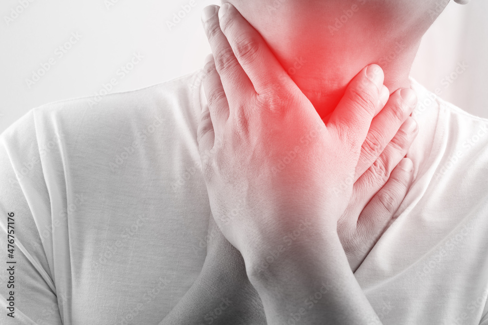 sore throat pain. Closeup of young man sick holding her inflamed throat ...