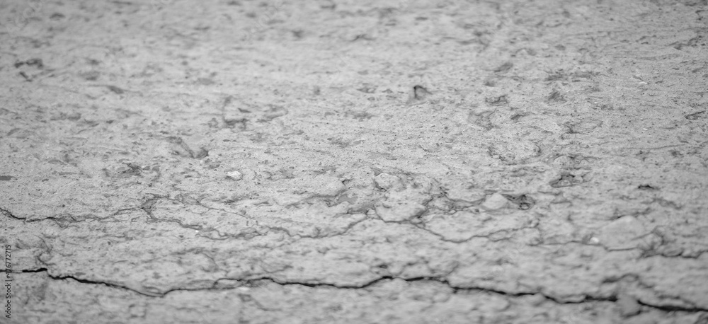 Shallow depth of field. Photo is blurred. Cracked concrete. Cracks in ...