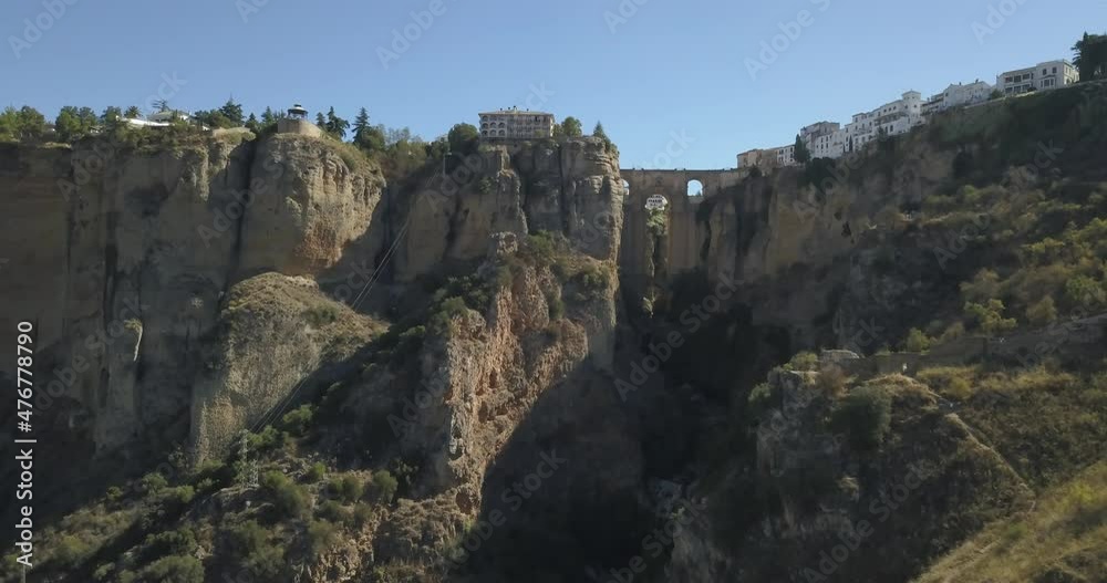 Aerial view at the full Ronda city, iconic New Bridge above the gauge ...