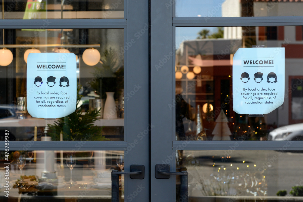 Welcome sign on store doors requesting all visitors wear masks before ...