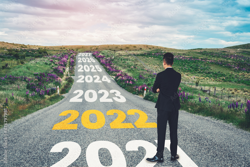 The 2022 New Year journey and future vision concept . Businessman ...