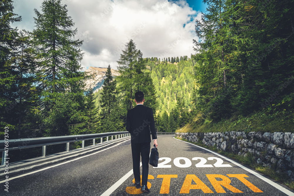 The 2022 New Year journey and future vision concept . Businessman ...