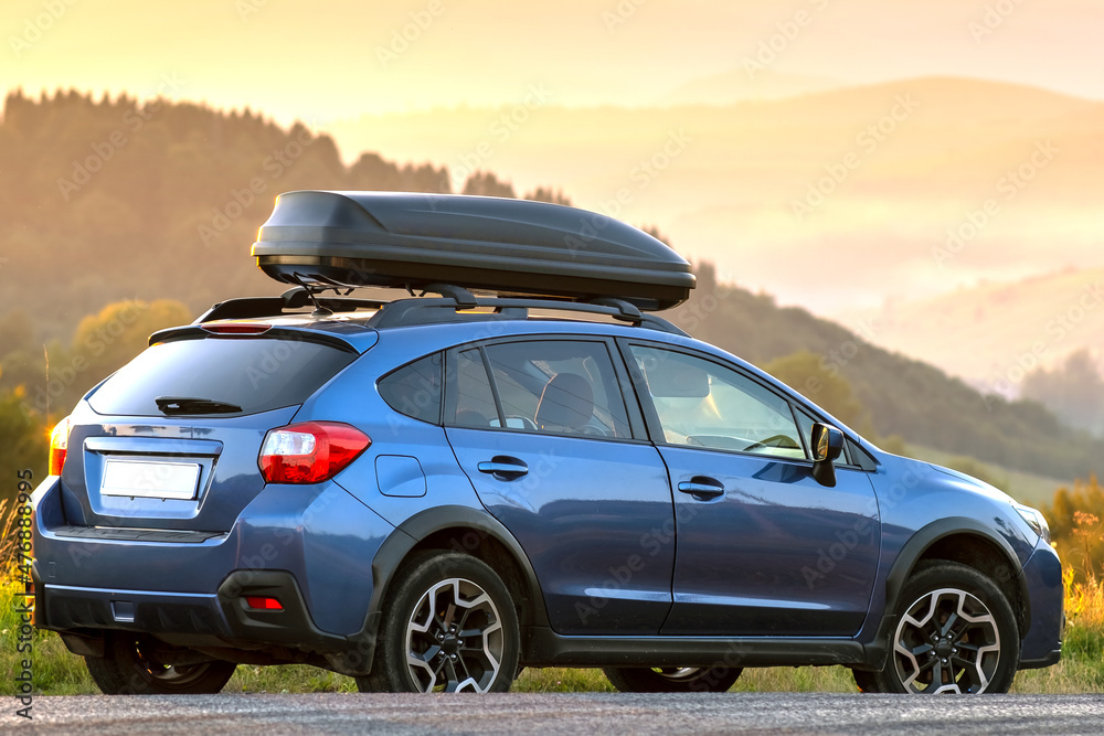SUV car with roof rack luggage container for off road travelling parked ...