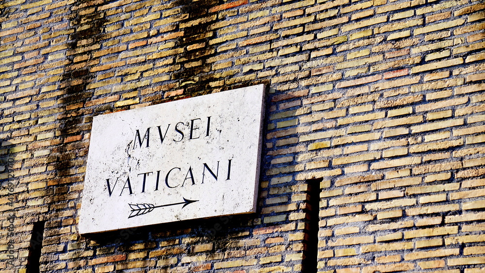 written Vatican museums in Italian on marble plaque above the vativane ...