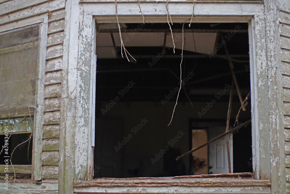 Old creepy scary wooden overgrown abandoned mansion broken window see ...