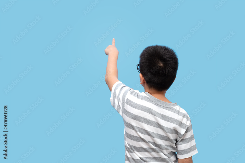 Kid with glasses and finger pointing upwards, back view Stock Photo ...
