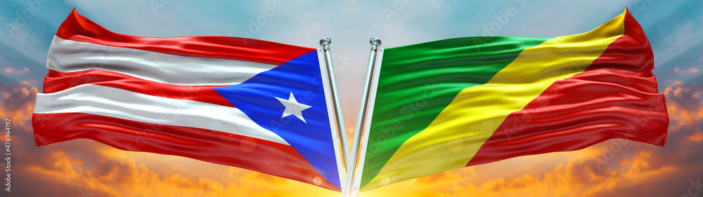 Puerto Rico flag and Republic of the Congo Flag waving with texture sky ...