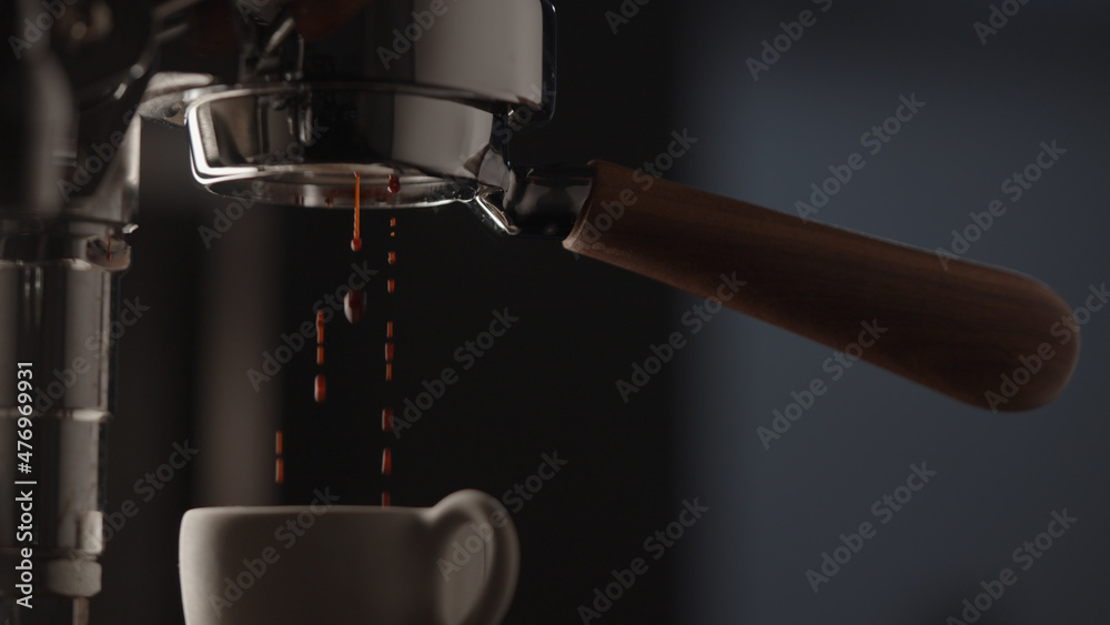 pull espresso shot with bottomless portafilter on a professional coffee ...