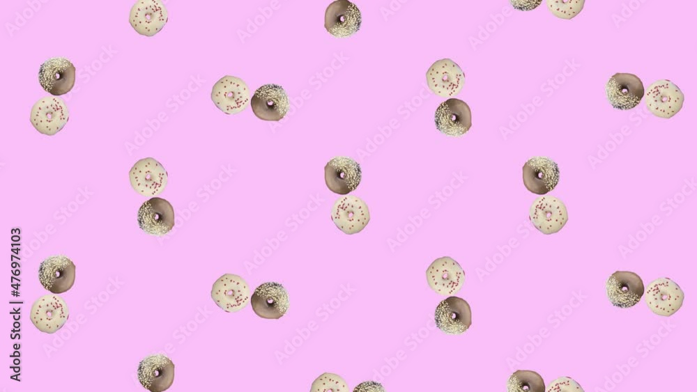 Colorful pattern of rotating donuts isolated on pink background ...