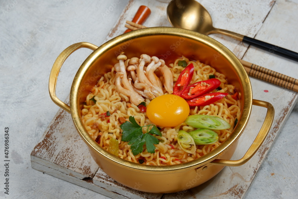 Serving a Korean style instant noodle, Ramyeon or Ramyun with spicy ...